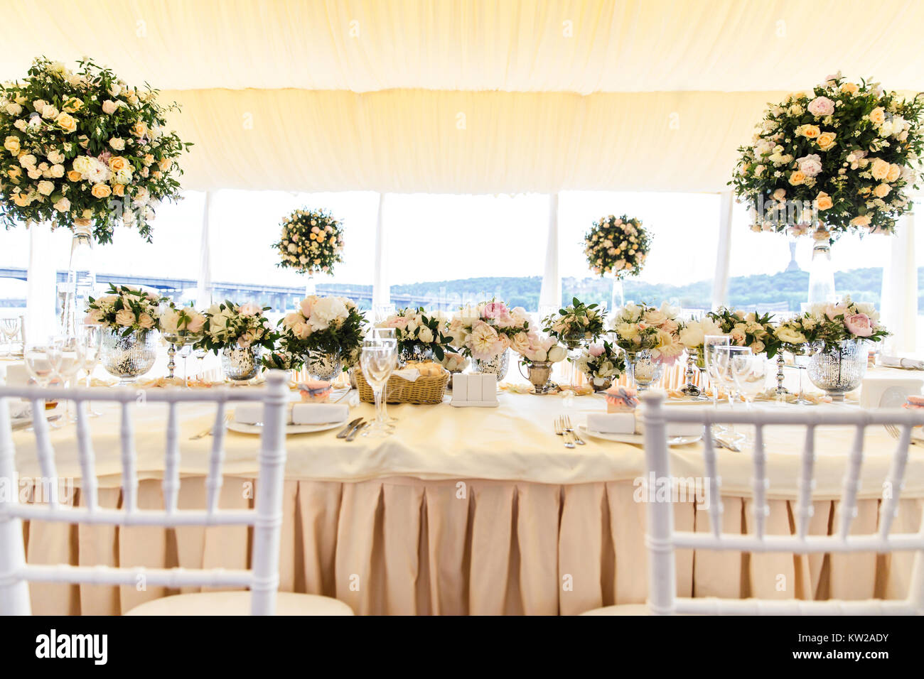 Table set for wedding with a beautiful flowers Stock Photo - Alamy