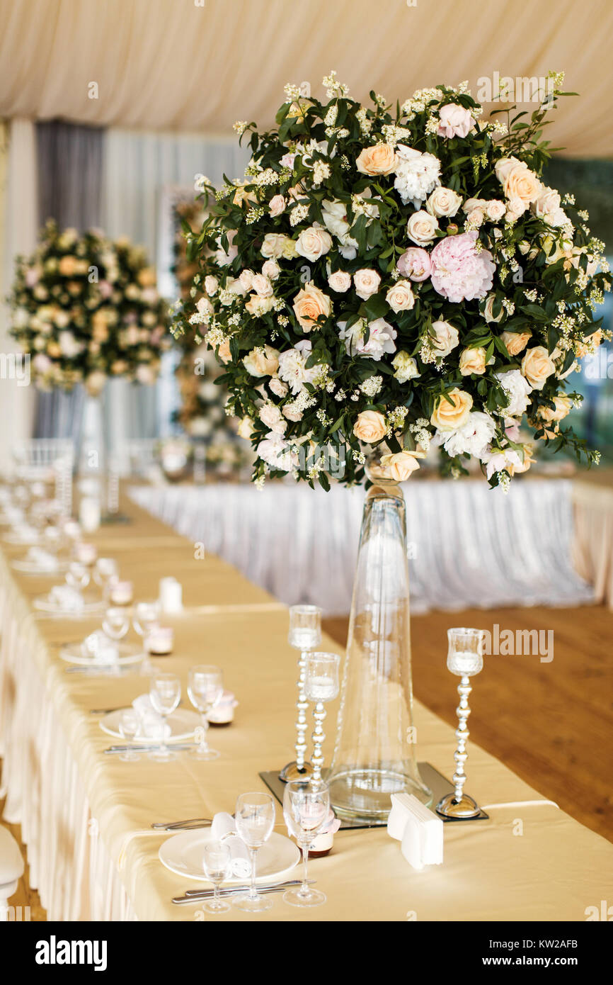 Table set for wedding with a beautiful flowers Stock Photo - Alamy