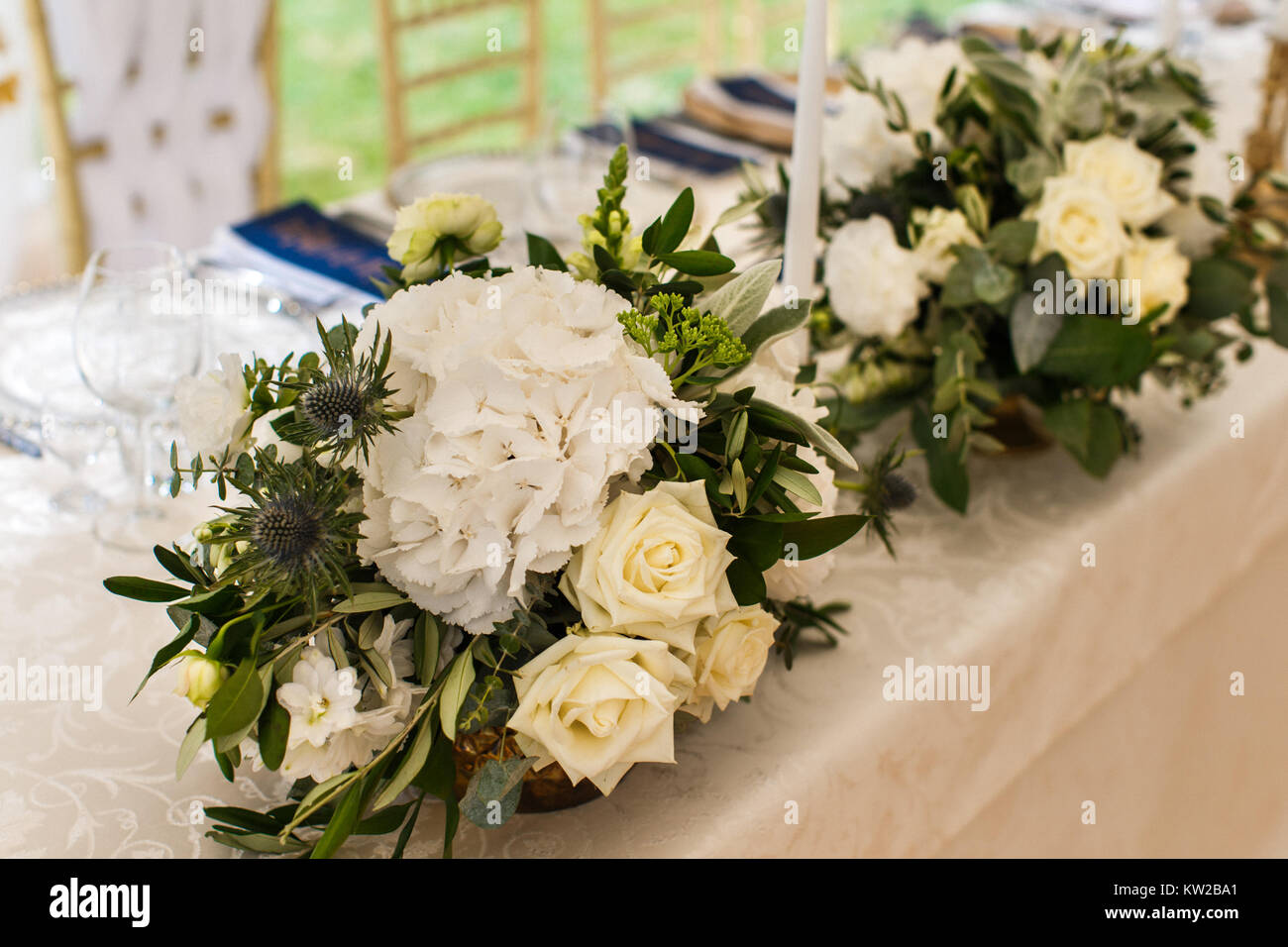 Bouquets flower in vase on the wedding table Stock Photo - Alamy