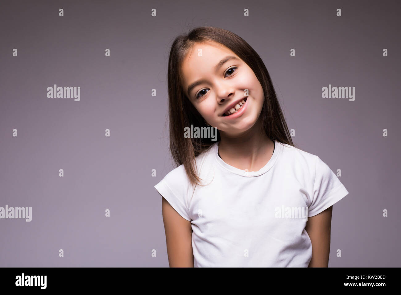 happy little girl a on white background Stock Photo - Alamy