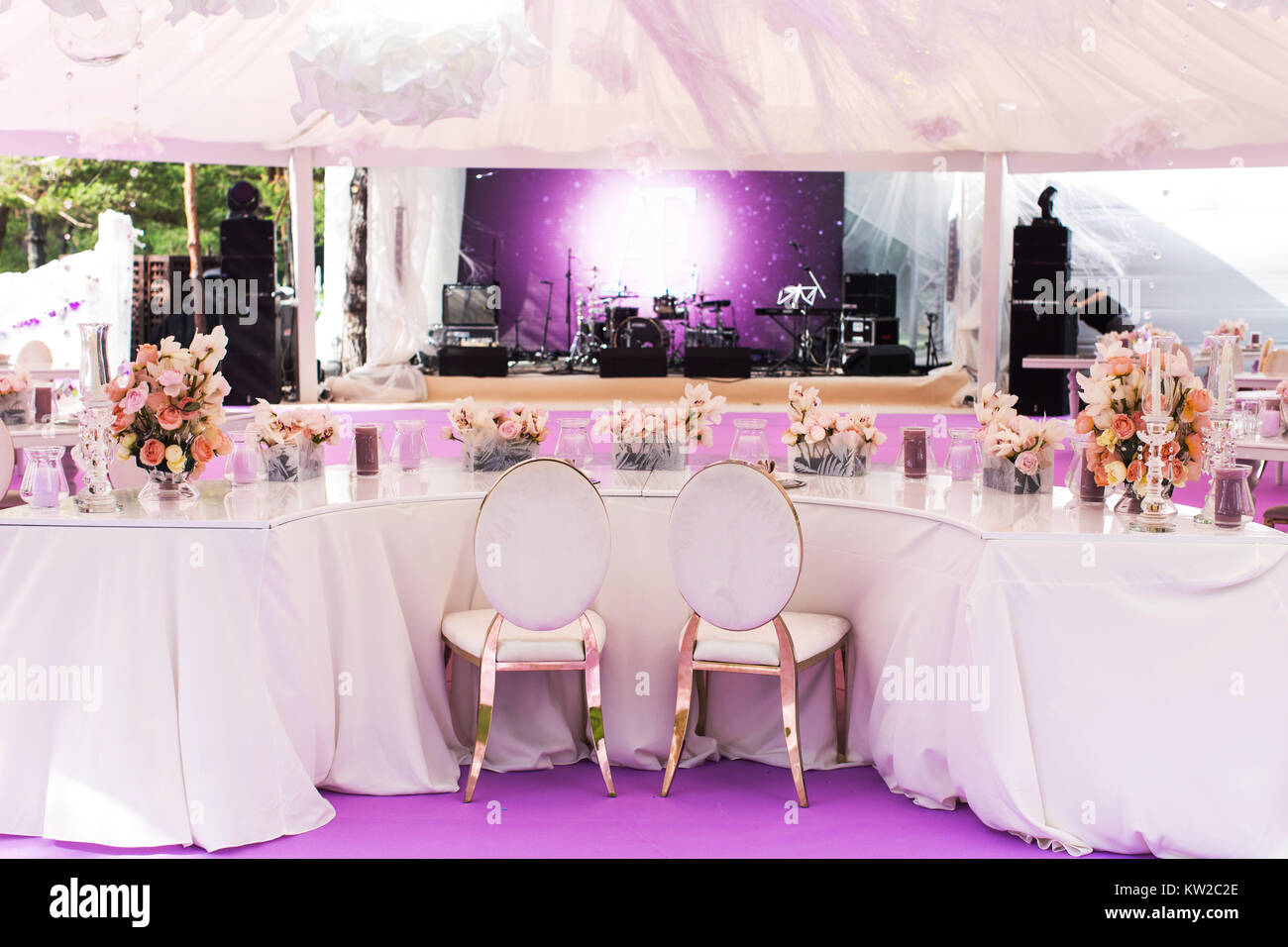 Table set for wedding or another catered event dinner and large white ...