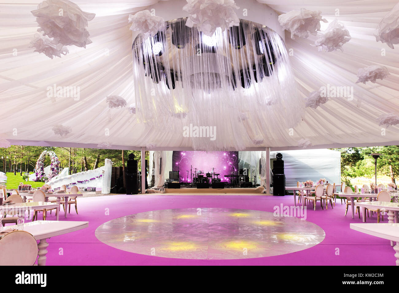Banquet hall for a wedding with a white dome. Tables sets for wedding ...