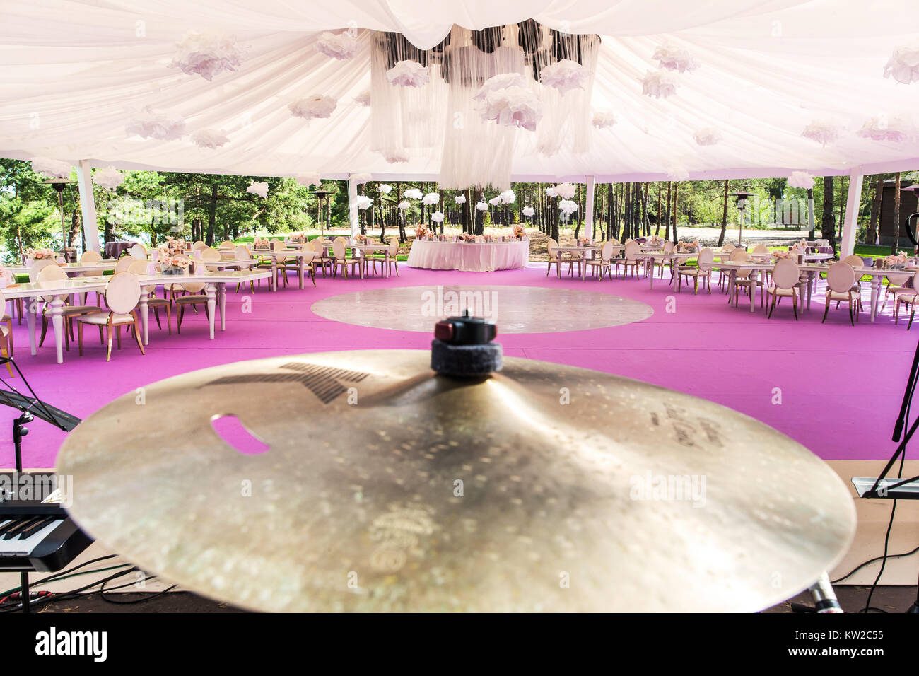 Banquet hall for a wedding with a white dome. Tables sets for wedding ...