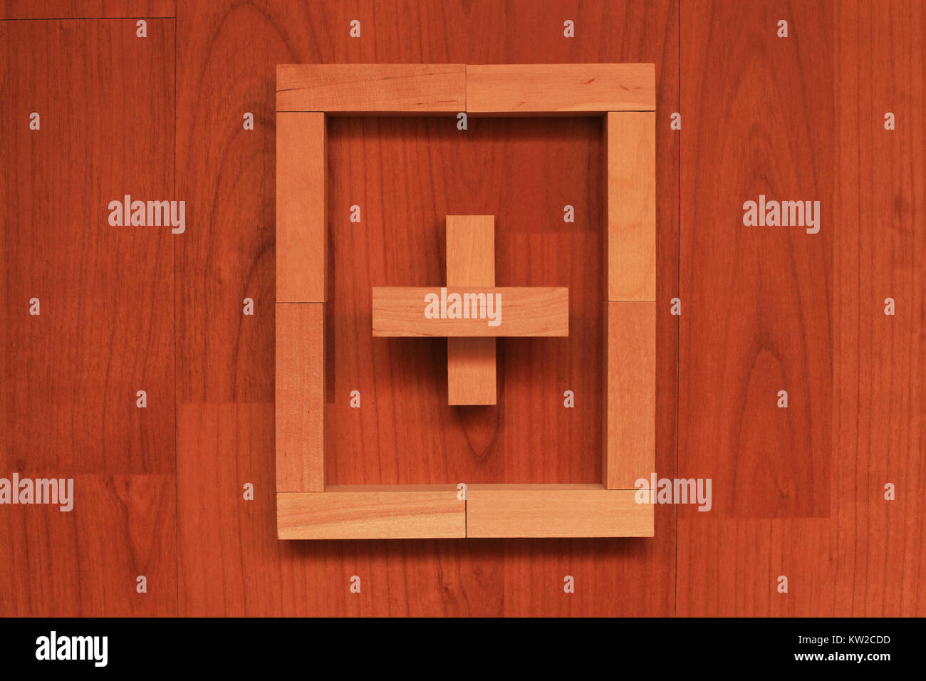 Wooden blocks in shape of Cross in frame on wooden background Stock ...