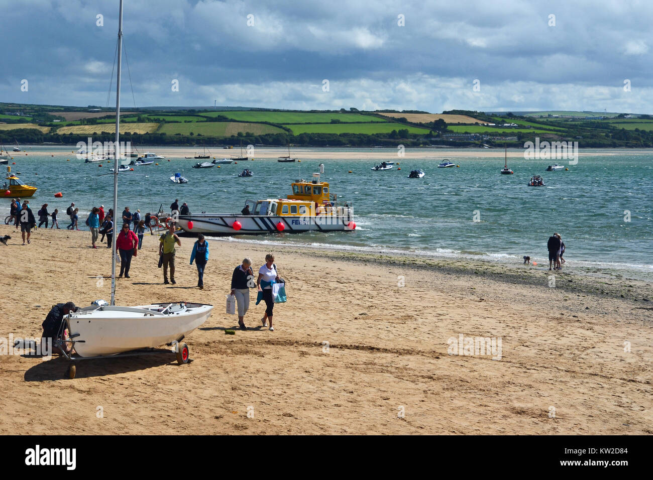 Ferry and yacht on the beach at Rock, Cornwall, England, UK Stock Photo ...