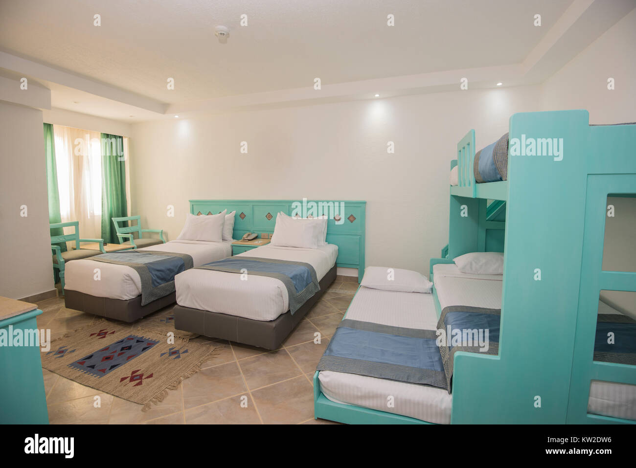 Five beds in family room of a luxury hotel resort with bunks Stock ...