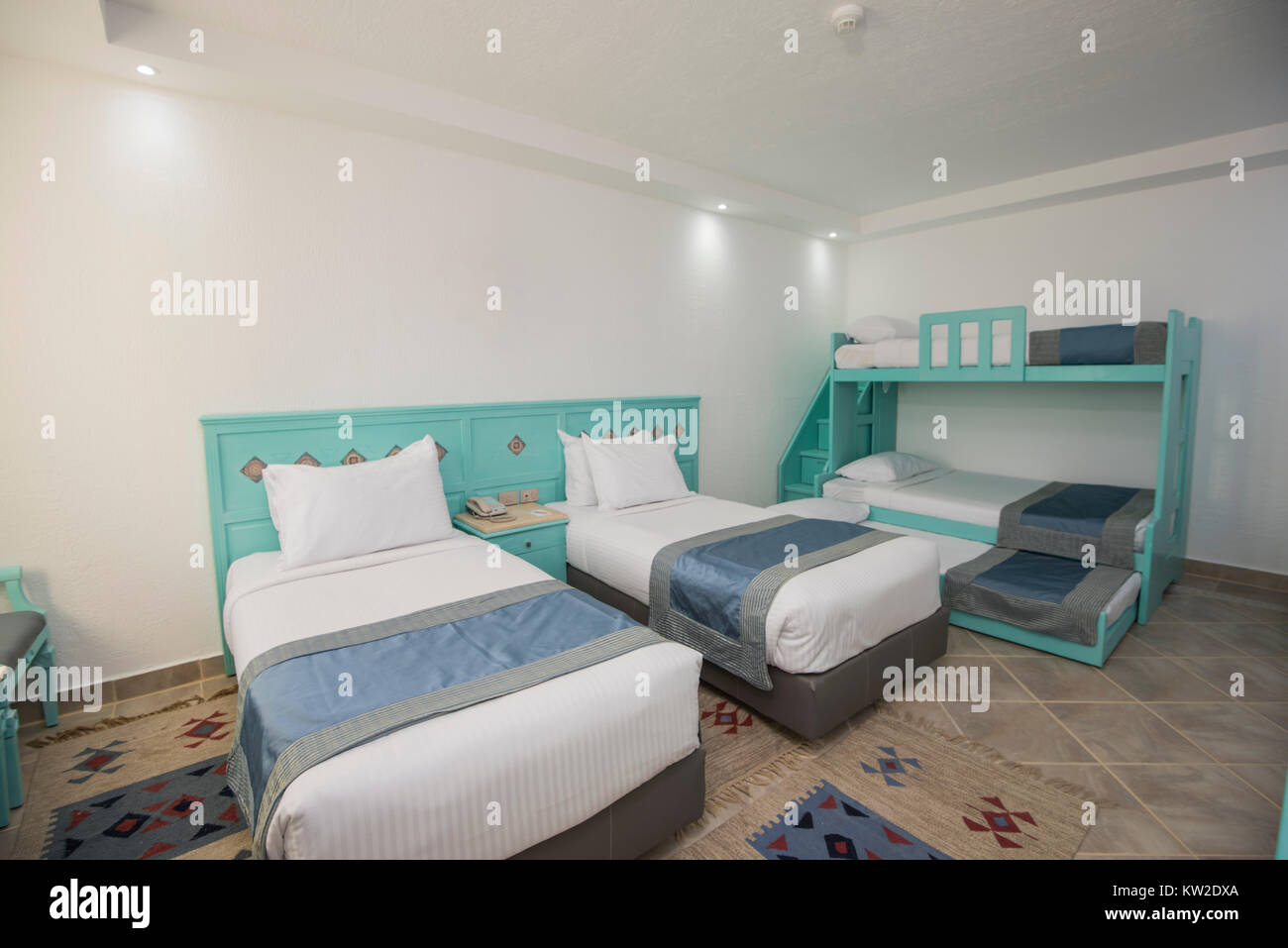 Five beds in family room of a luxury hotel resort with bunks Stock ...