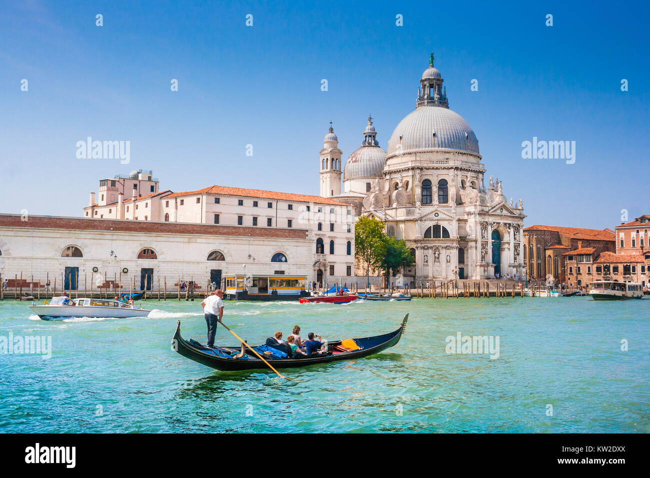 Beautiful View Of Traditional Gondola On Canal Grande With Historic