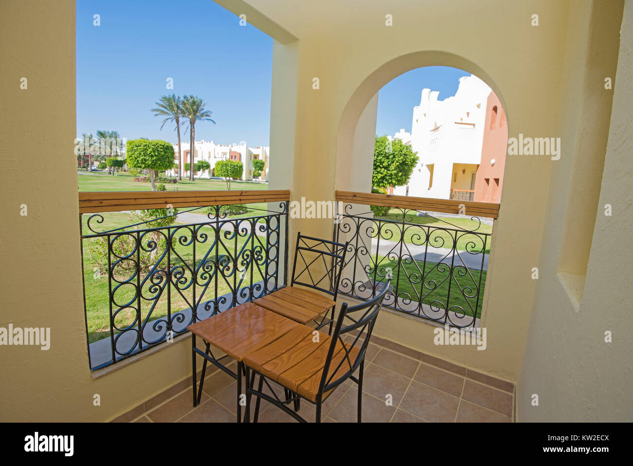 View from a balcony terrace of luxury hotel resort room with gardens ...