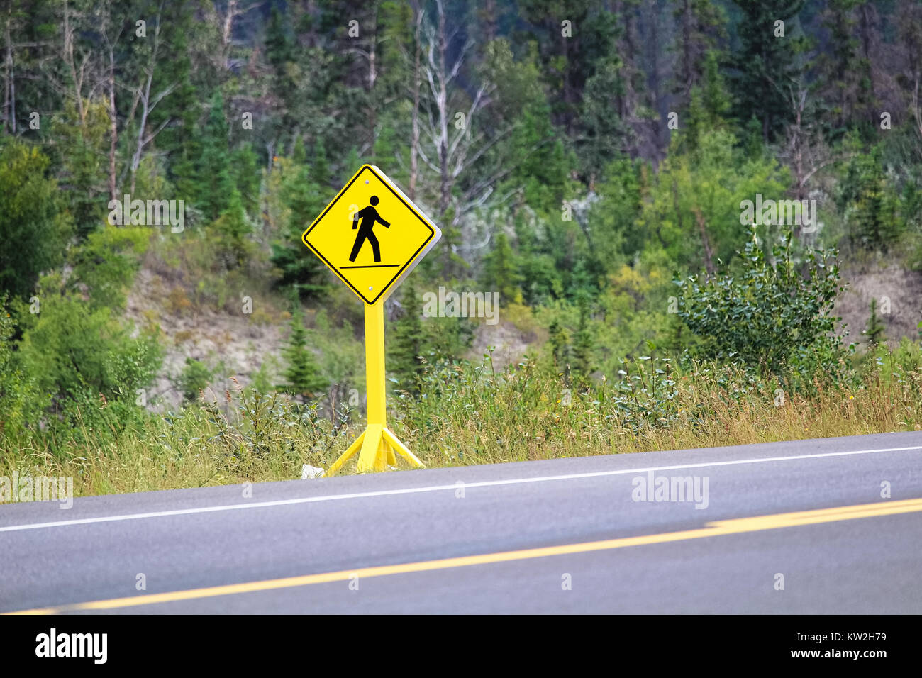 A pedestrian crossing sign on a highway Stock Photo - Alamy
