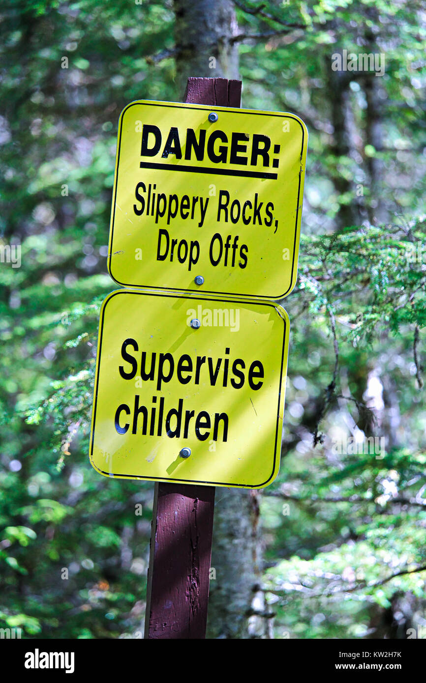 Danger slippery rocks, drop offs and supervise children sign Stock ...