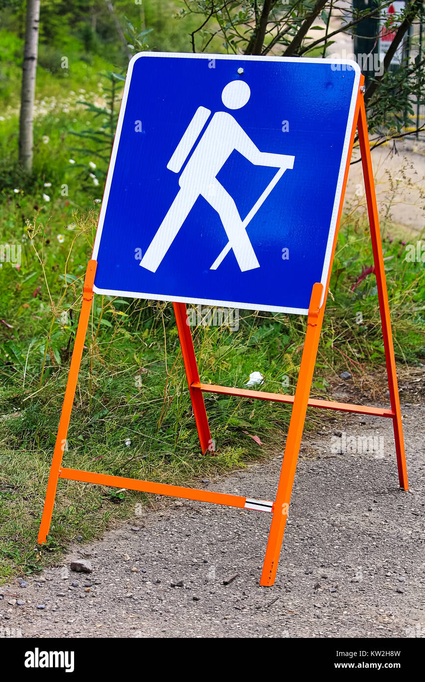 A temporary blue hiking sign for a trail Stock Photo - Alamy