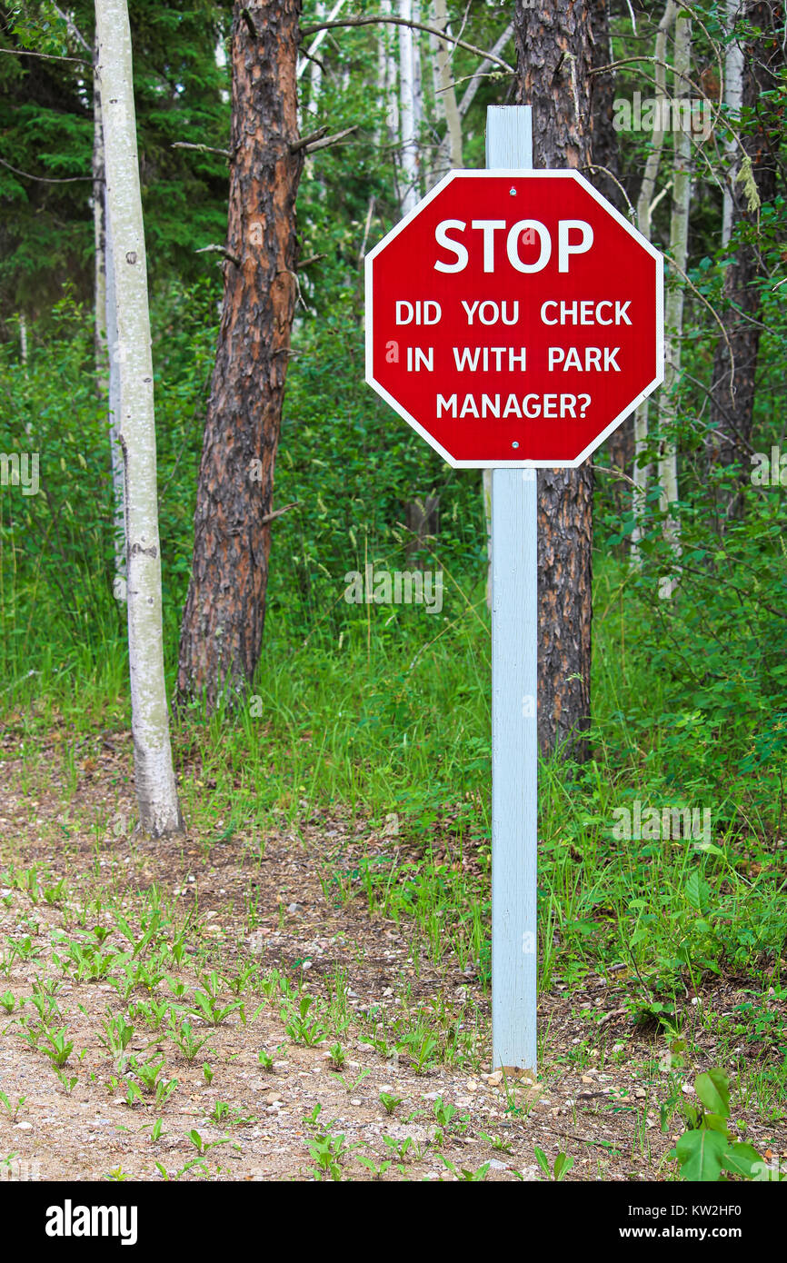 A stop, did you check with the park manager sign Stock Photo - Alamy