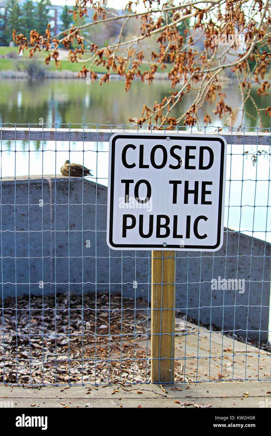 A lakeside path with a closed to the public sign Stock Photo - Alamy