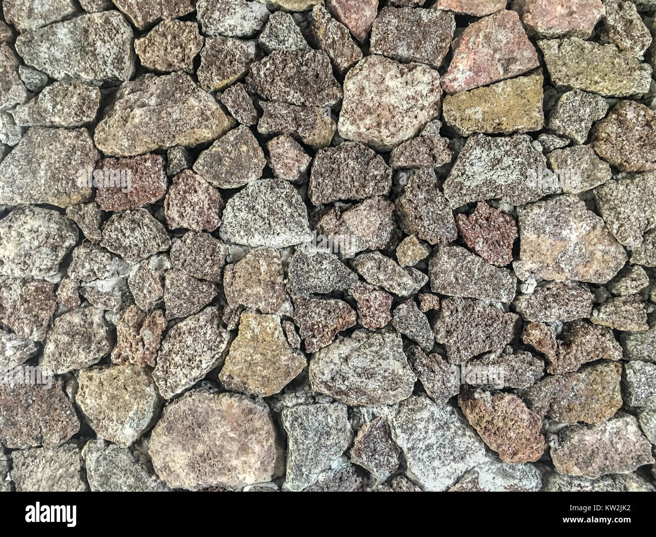 Close-up rough big stones wall texture background Stock Photo - Alamy