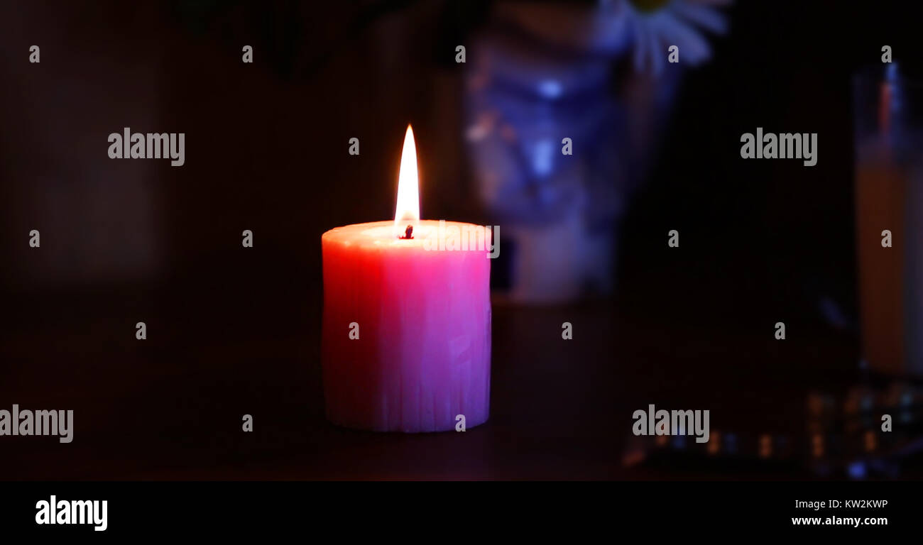 Candle flame at night closeup Stock Photo - Alamy