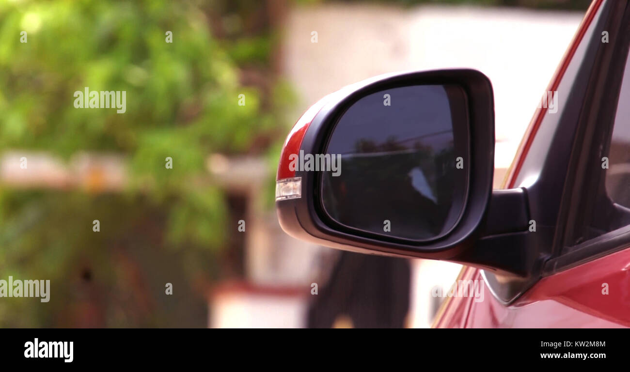 Rear view mirror on a sunny day with clouds, concept looking back Stock ...