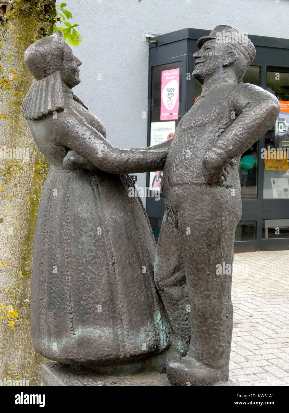 The image features traditional Dutch folk dancers, known as ...