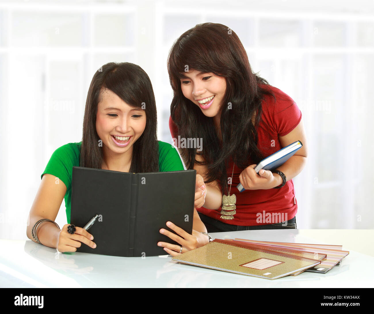 College girls sharing room reading hi-res stock photography and images ...