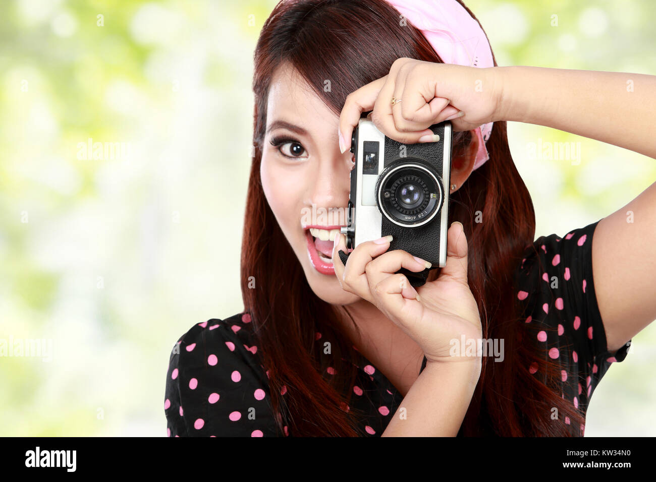 Beautiful woman with vintage camera Stock Photo - Alamy