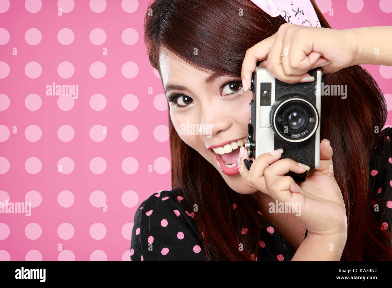 Beautiful woman with vintage camera Stock Photo - Alamy