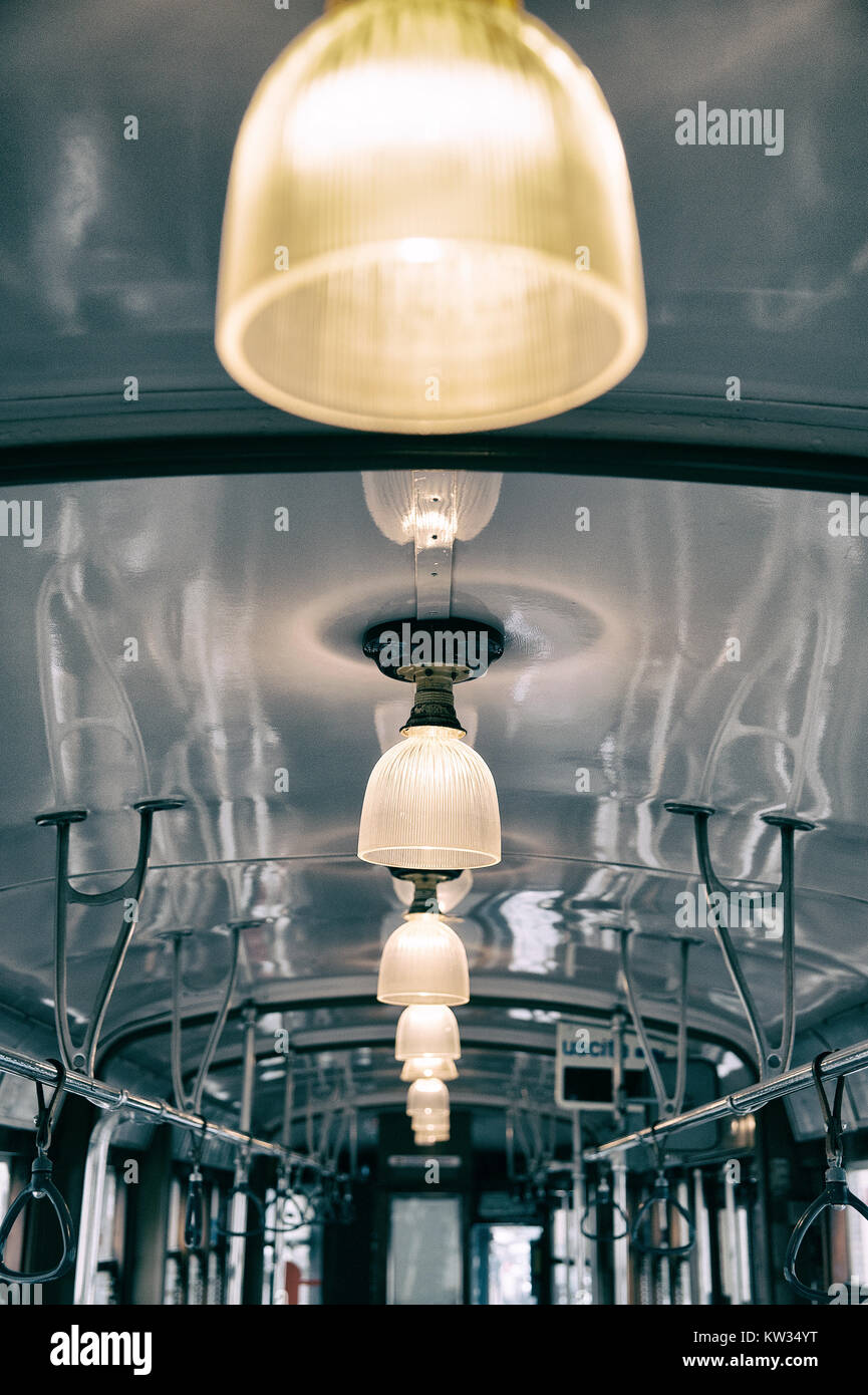 Interior view of classic Milan tram with wooden seat and machined glass ...