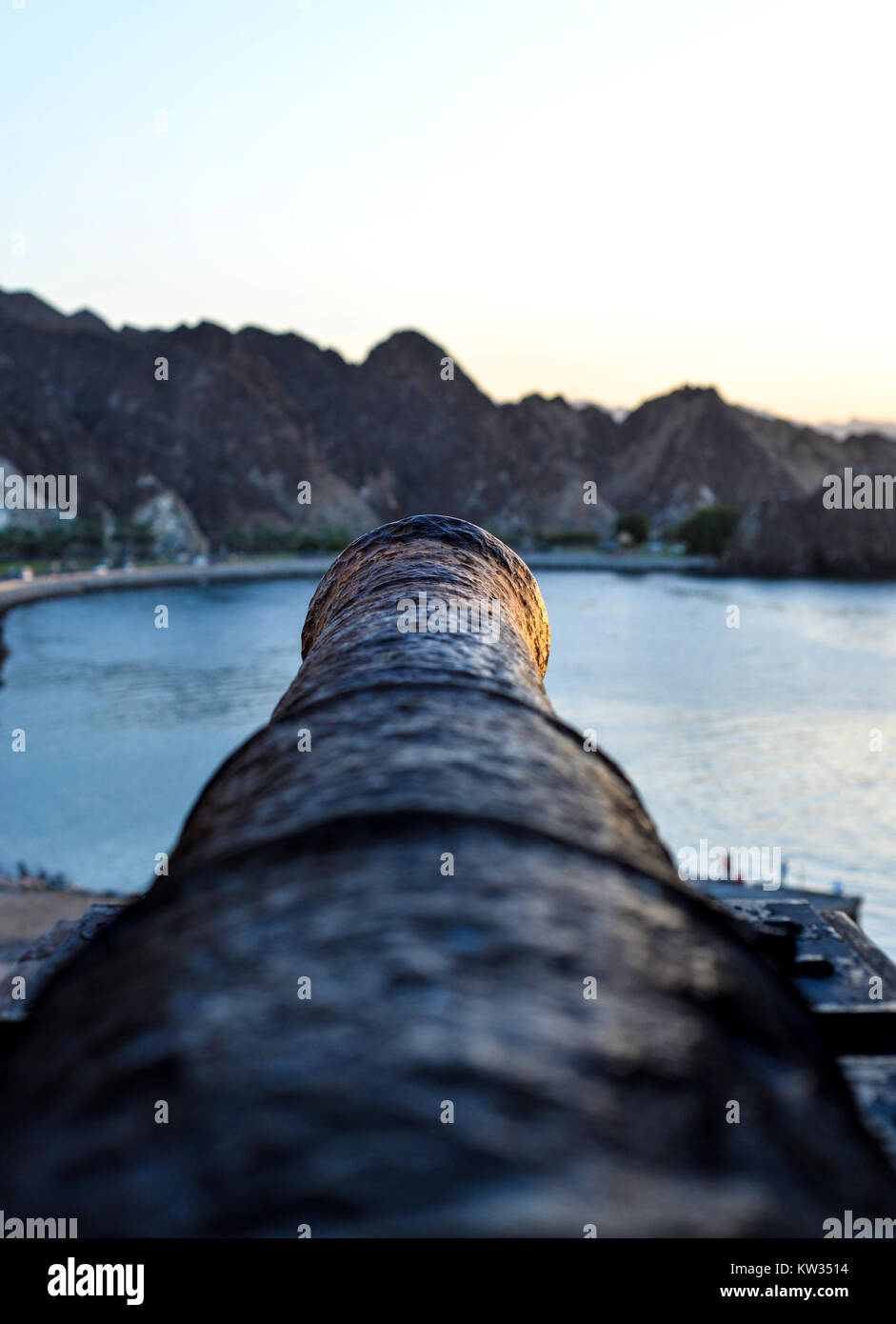The canon overlooking Muscat Harbour - Oman Stock Photo - Alamy