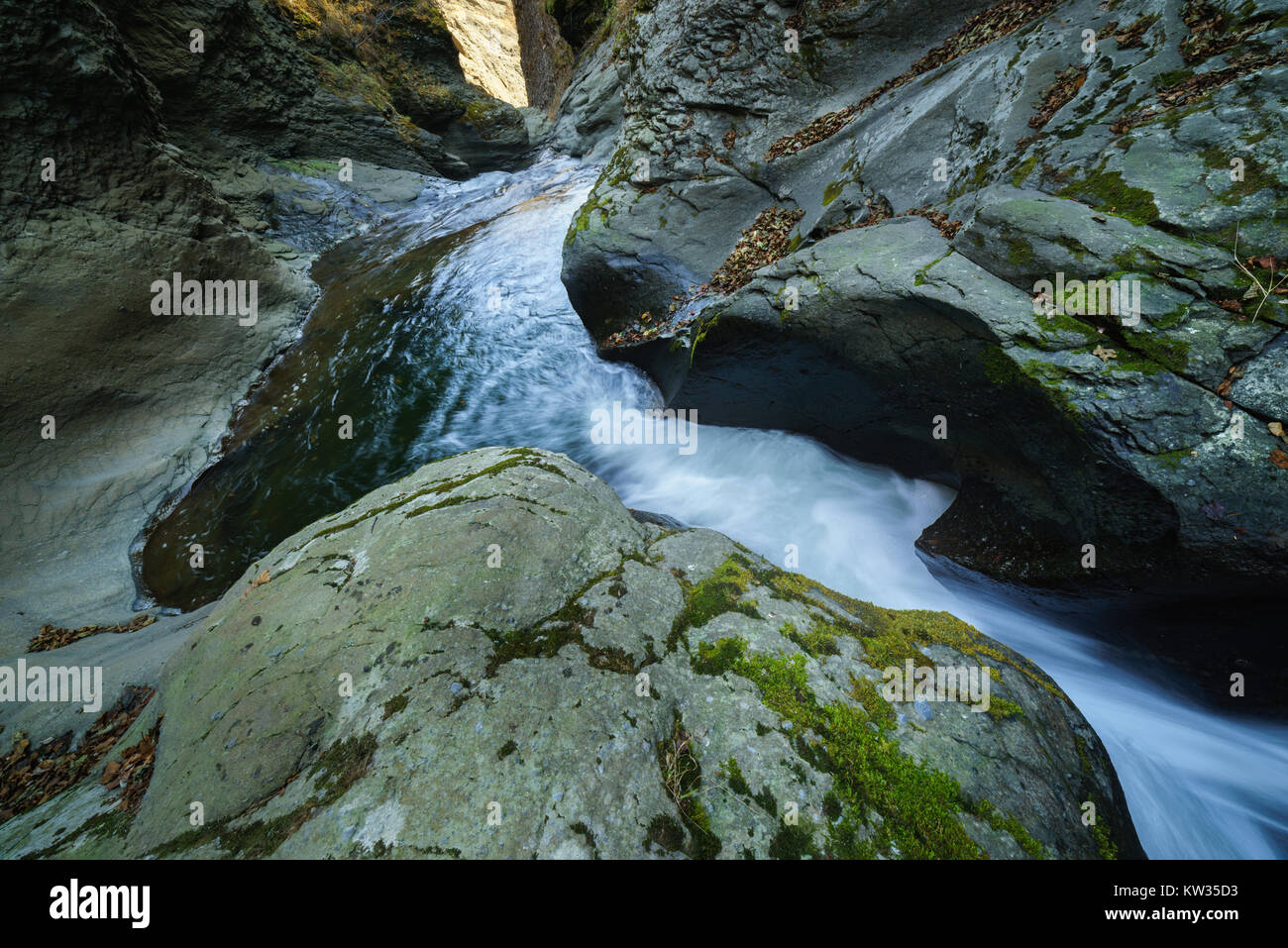 Mountain river with small canyons and waterfalls in late autumn with ...