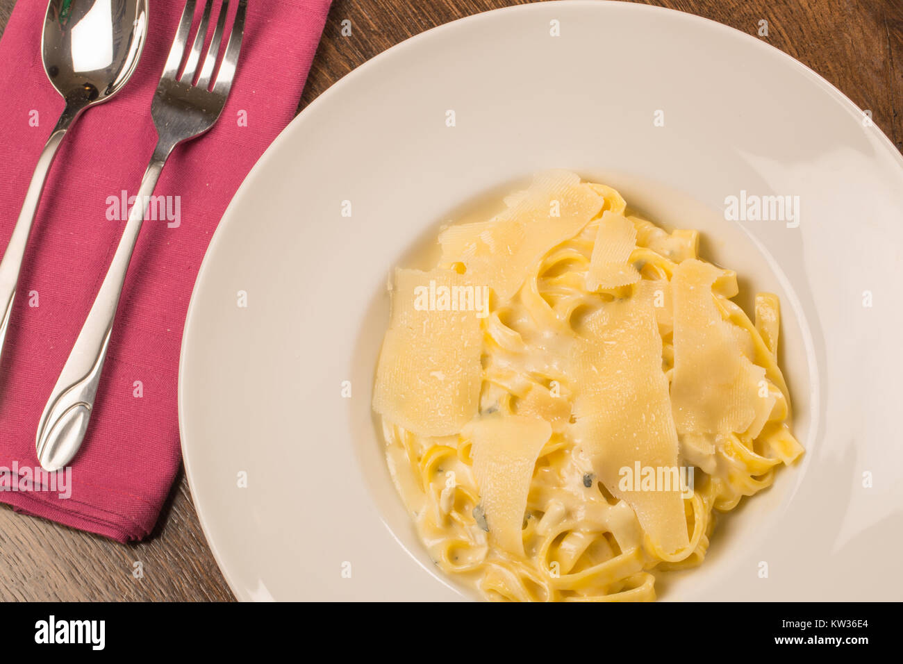 Four cheese pasta in a white plate Stock Photo - Alamy