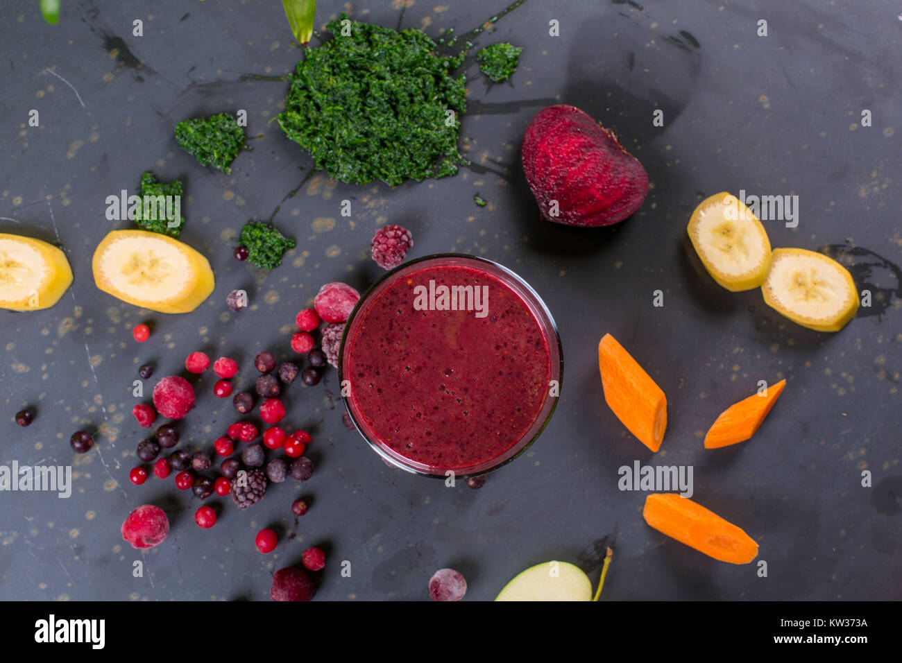 close up of red forest fruits smoothie on a black stone Stock Photo - Alamy
