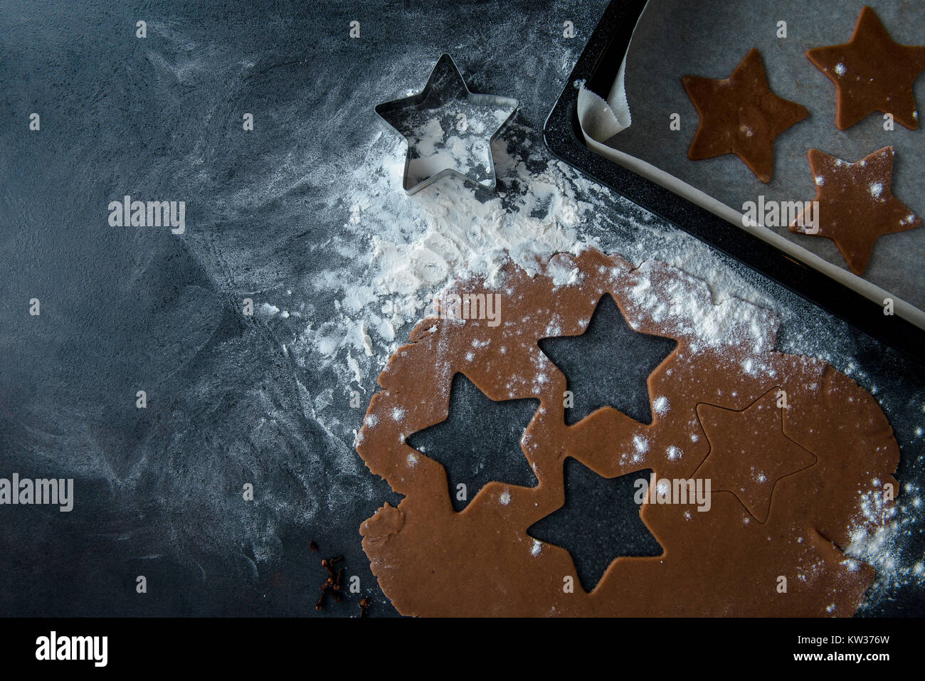 Christmas gingerbread star cookie cutter on flour, gingerbread dough ...