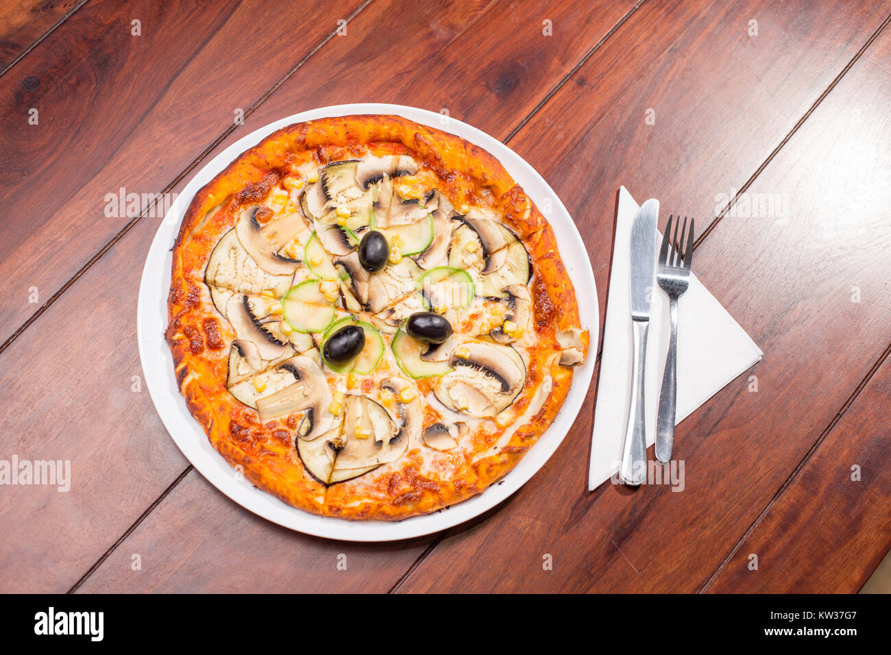 Top view of vegetable restaurant pizza on a table Stock Photo - Alamy