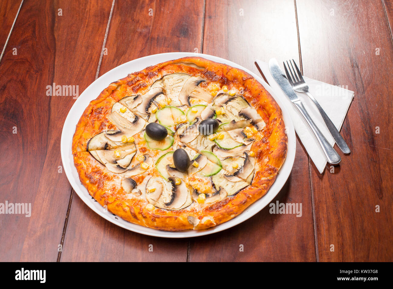 Top view of vegetable restaurant pizza on a table Stock Photo - Alamy