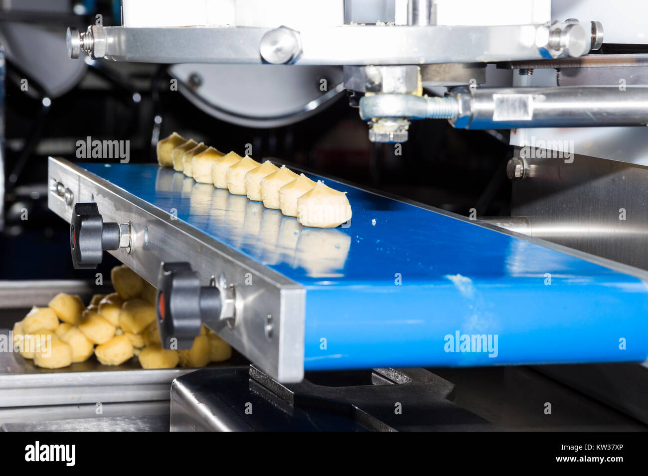 food in conveyor of machine ; selective focus Stock Photo - Alamy