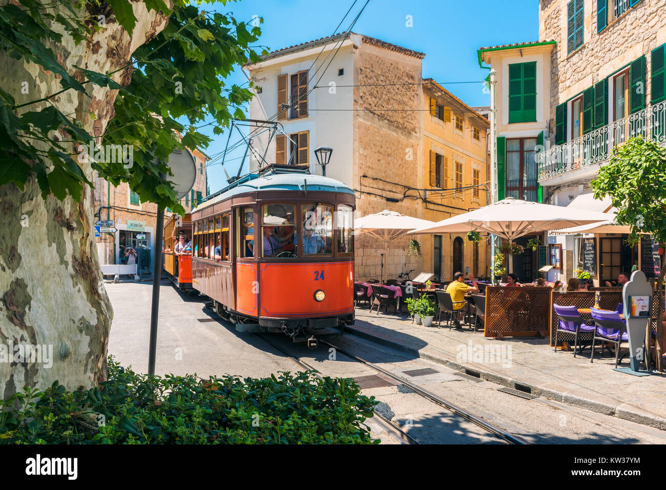Old Tram of the Soller Tramway line driving in a street in Soller ...