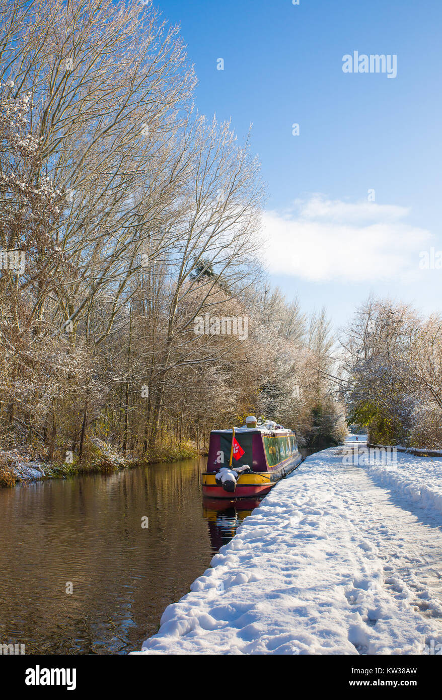 Gloriously sunny winter canal scene, UK. Colourful canal boat moored ...
