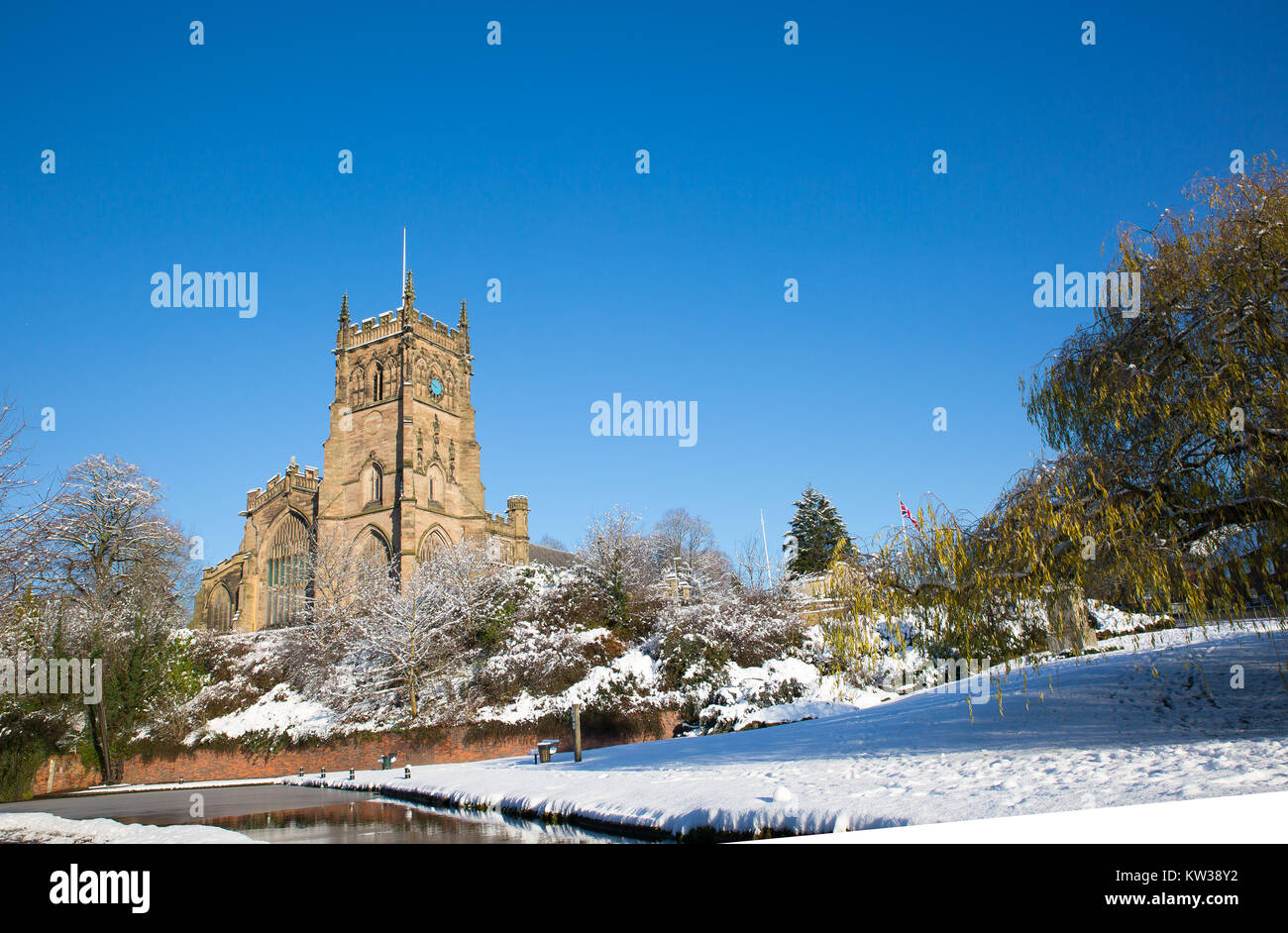 English snow scene; St.Mary's Church, Kidderminster, UK. Snow on ground ...