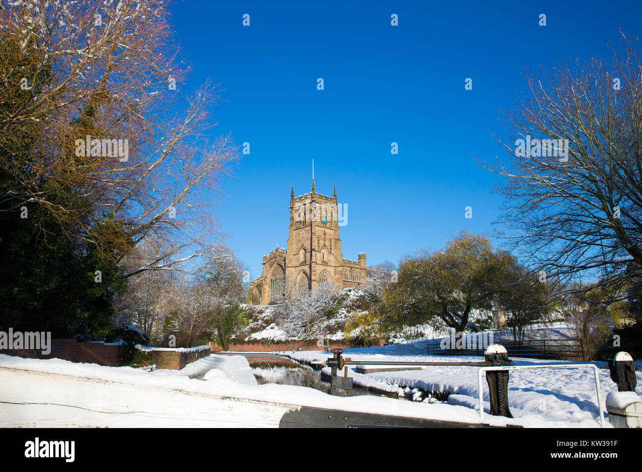English snow scene; St.Mary's Church, Kidderminster, UK. Snow on ground ...