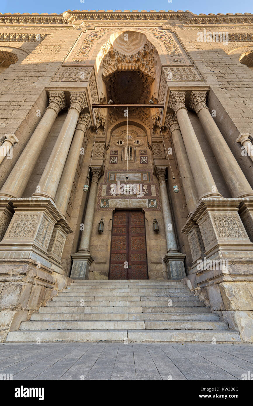 Entrance of al Rifai Mosque with closed decorated wooden door, ornate ...