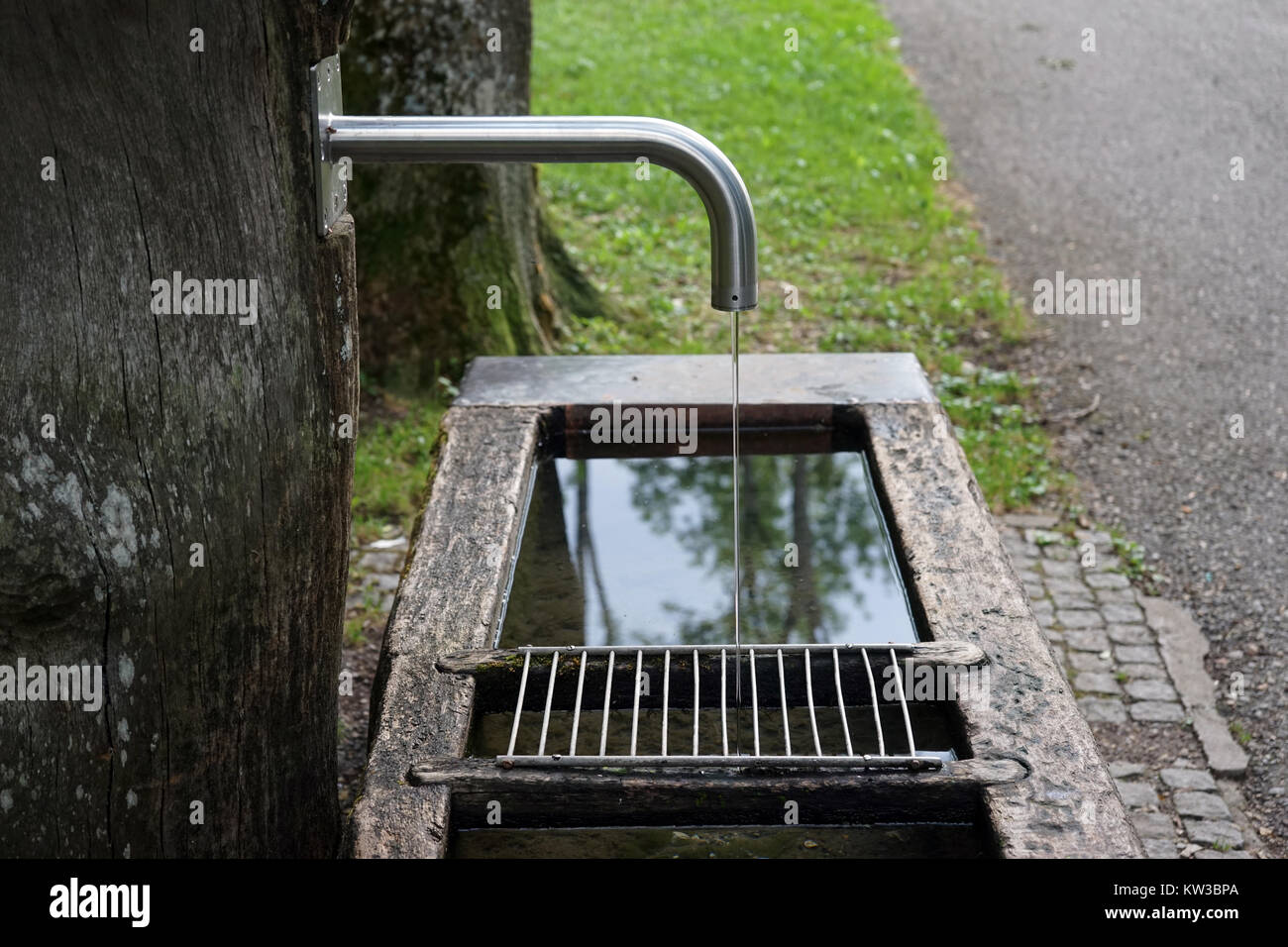 Clean spring water fountain in the park, Germany Stock Photo - Alamy