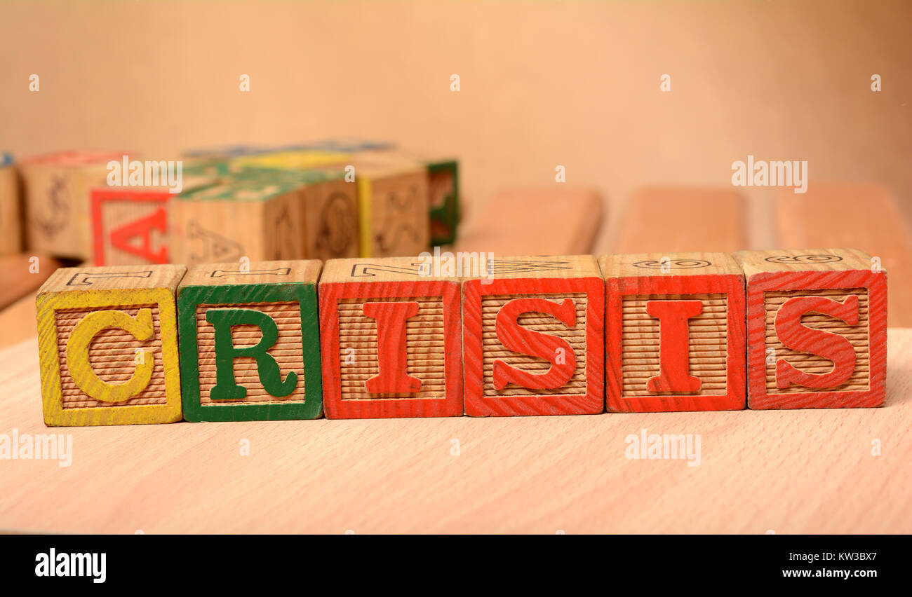 Crisis Words on Wooden Block in background Stock Photo - Alamy