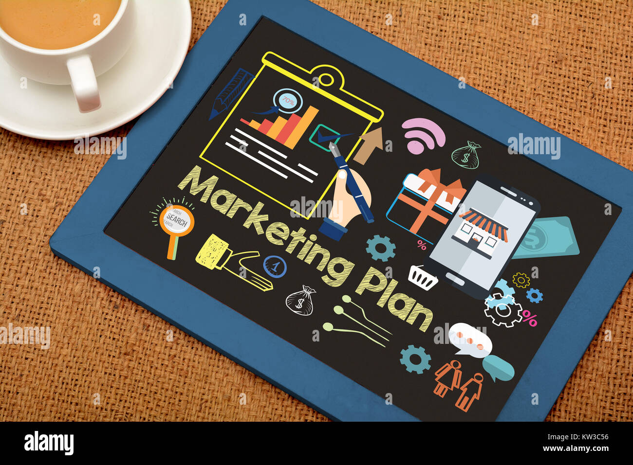 Marketing Plan Drawing icons on slate with cup of tea Stock Photo - Alamy