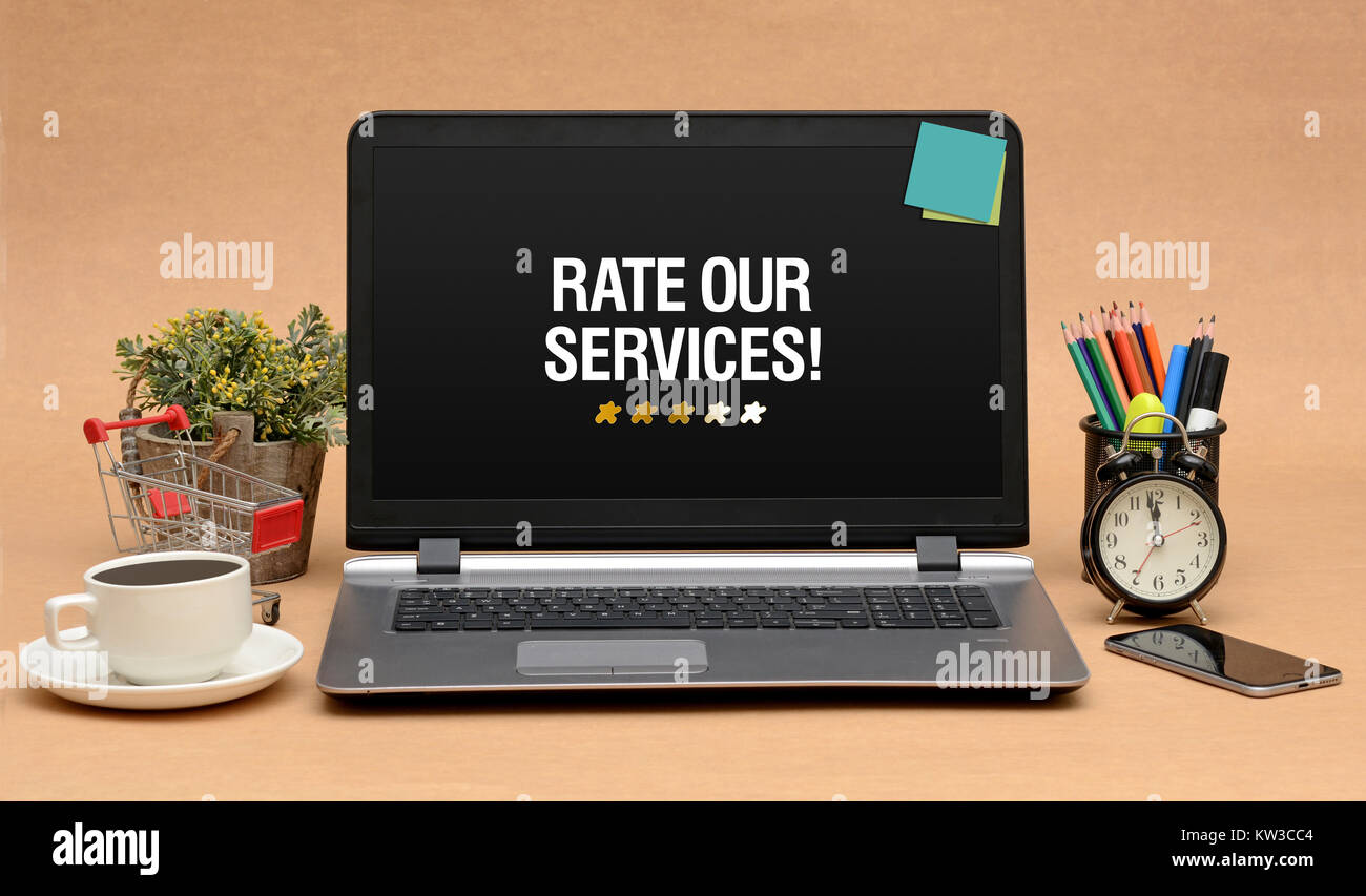 Rate our Services Sign with Stars on Laptop Monitor Stock Photo - Alamy