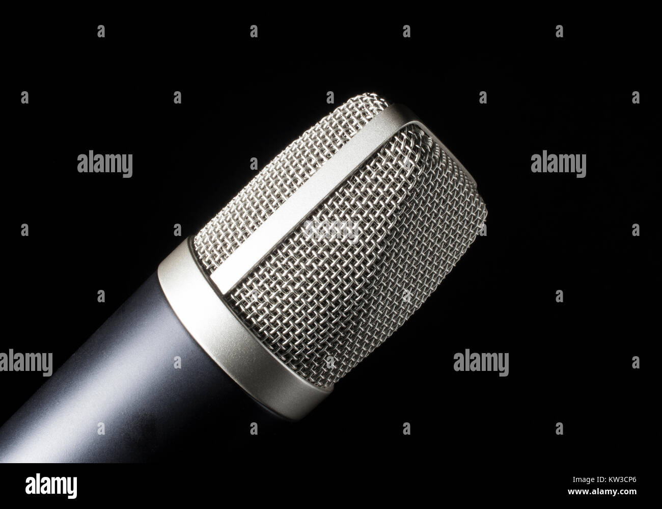 Microphone covered in metal mesh on a black background Stock Photo - Alamy