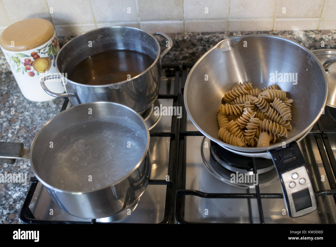 boiling water in pan to prepare wholemeal pasta Stock Photo - Alamy