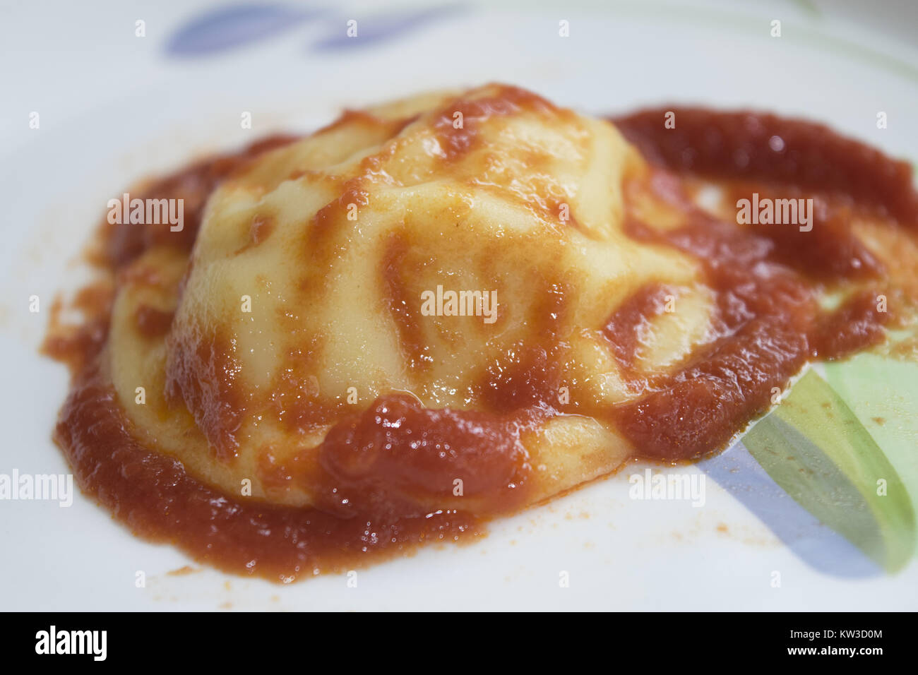italian kind of dumpling pasta called raviolo and seasoned with tomato ...