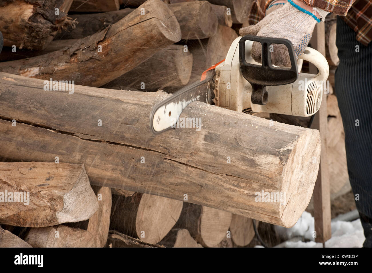 Man cutting wood Stock Photo - Alamy
