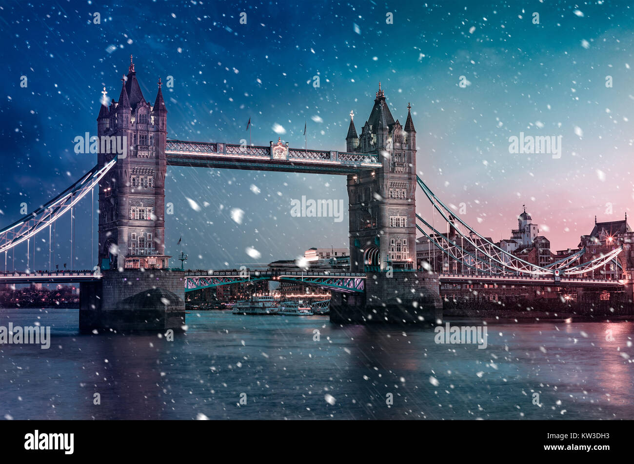 Tower Bridge with falling snow during sunset, London, United Kingdom ...