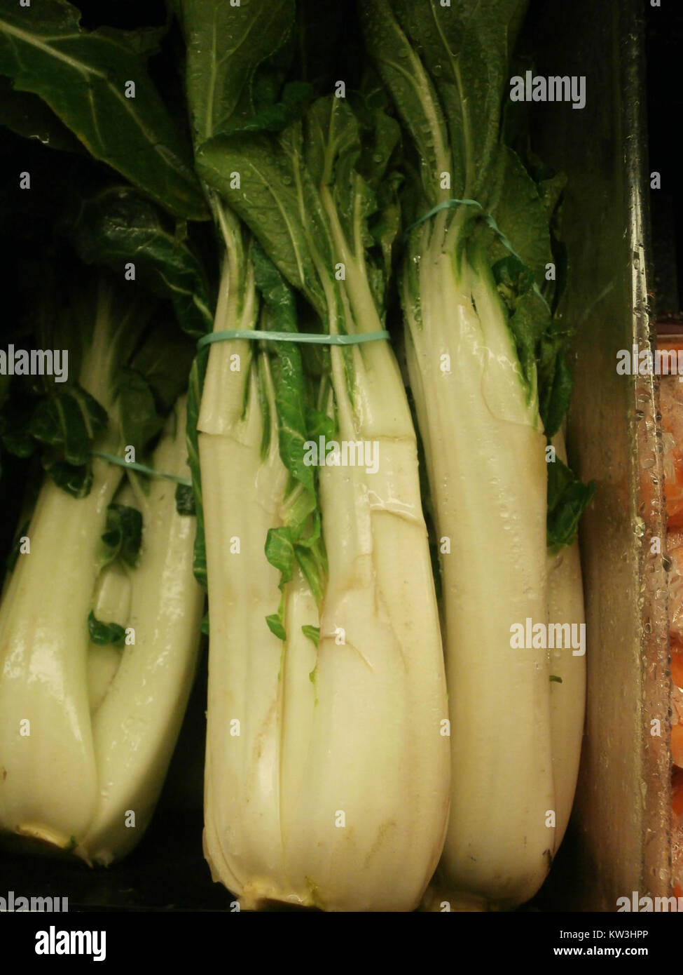 Bok choy, a popular leafy green vegetable, is commonly sold in bunches ...