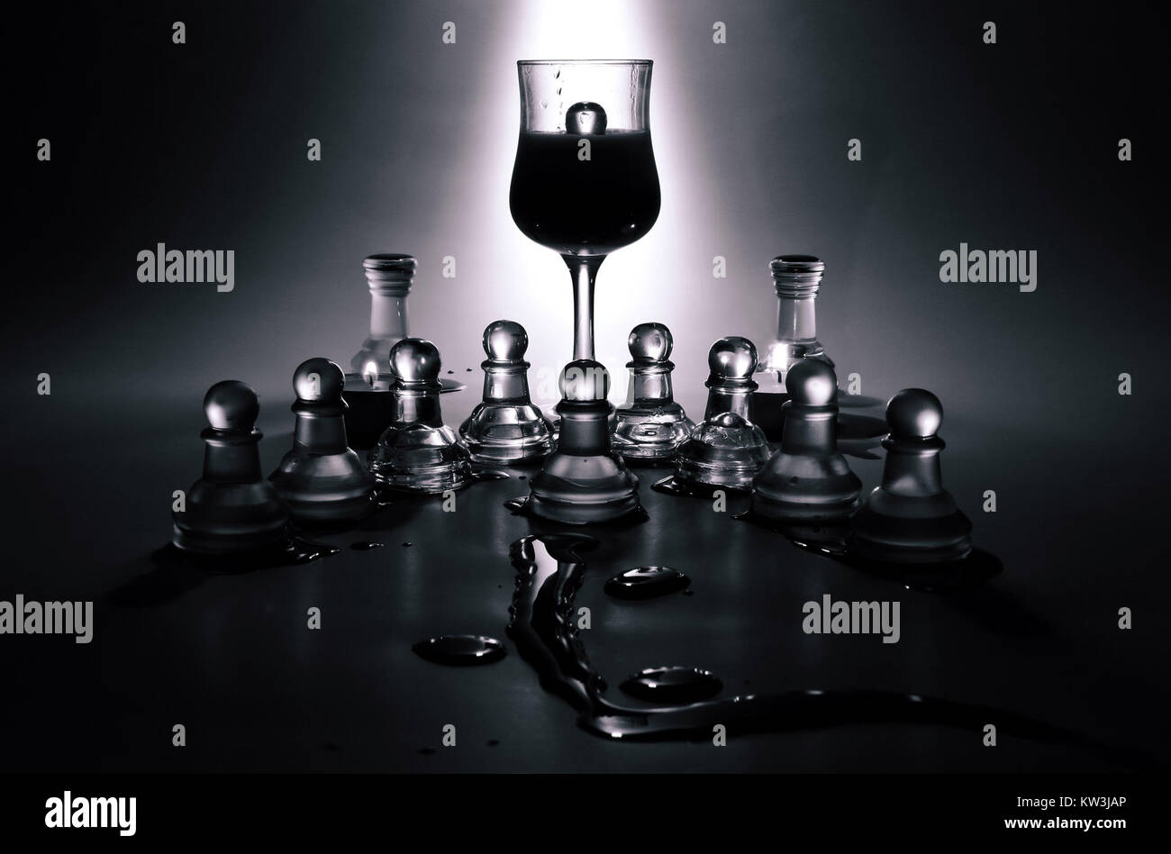 This image shows a black and white glass chess set, showcasing the ...